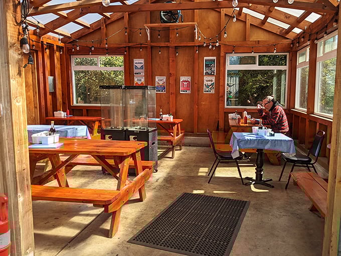 Sunlight streams through the wooden beams, creating a greenhouse effect that warms both the space and the soul.