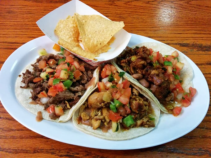 Tacos presented with the simplicity and confidence of a three-act play—each protein telling its own delicious story on a corn tortilla stage.