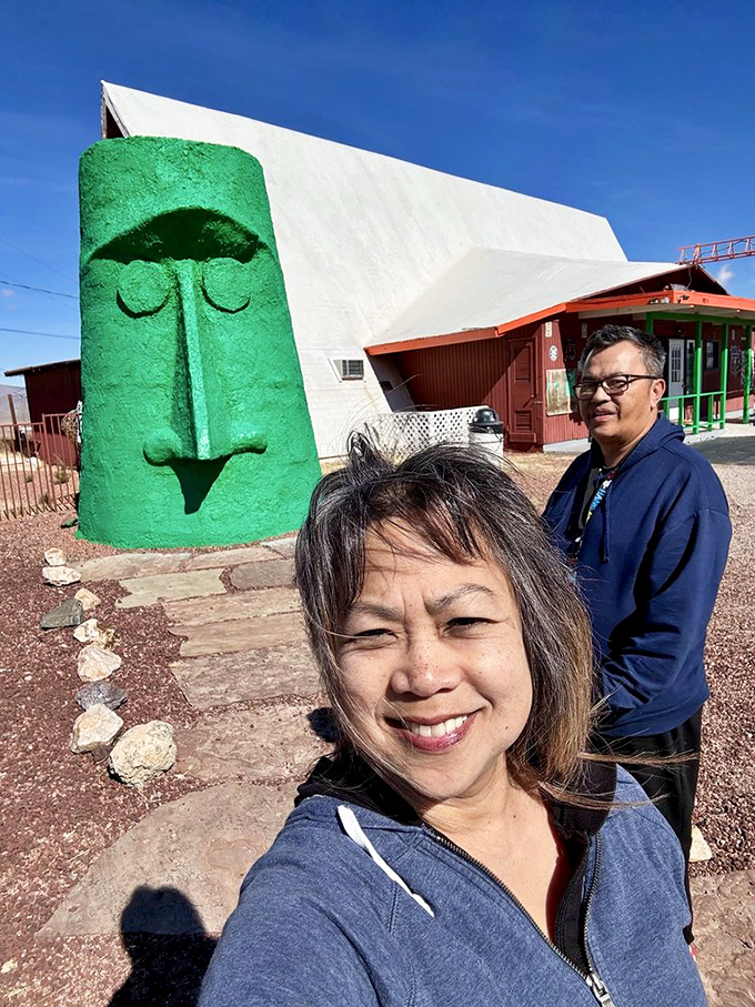 Visitors capture the obligatory selfie – proof that you've joined the exclusive club of people who've gone out of their way for a giant head.