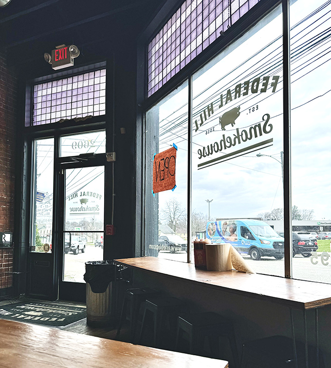 Sunlight streams through windows framing the simple dining space—a temple of meat where conversation stops when the food arrives.