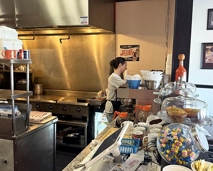 Where the magic happens! A glimpse into the kitchen choreography that transforms simple ingredients into plates of joy.