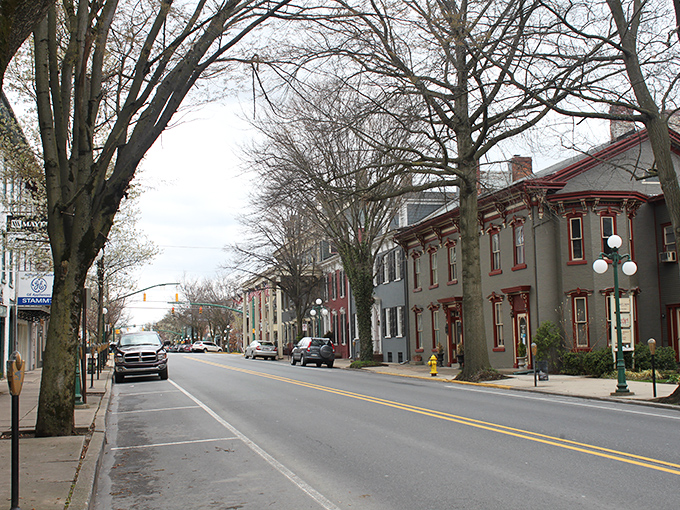 Lewisburg's brick sidewalks and blue storefronts create a storybook setting where shopping local isn't trendy—it's tradition.