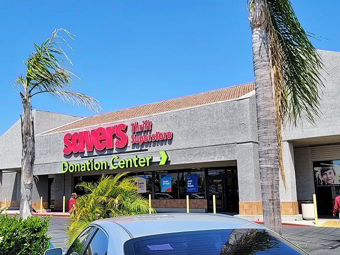 Savers' bold red signage pops against the neutral building. Those palm trees aren't the only things providing shade – check out those prices!