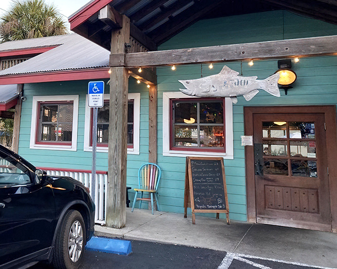 That weathered fish sign isn’t just for show—it marks the spot for grouper sandwich heaven.