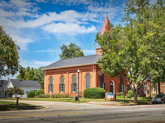 The red brick buildings of Greensboro's main street create a warm welcome, especially when bathed in golden evening light.