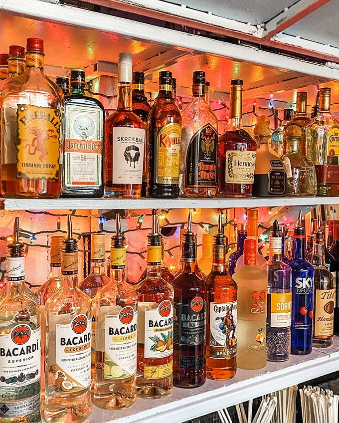 The liquor selection shines like a beacon for thirsty travelers. These bottles have stories to tell—if you're willing to listen.
