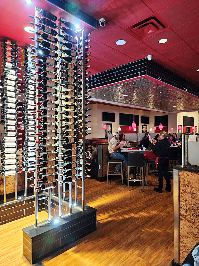 That wine display isn't just impressive – it's practically a structural element of the restaurant. Bottles upon bottles of liquid possibilities.