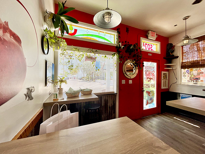 Plants hanging from the ceiling, natural light streaming in—it's like dining in a tropical greenhouse where the only thing growing is your appetite.