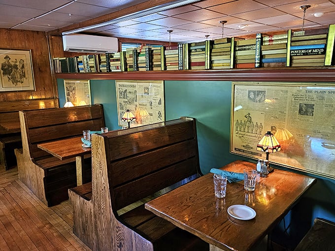 Cozy wooden booths where newspapers frame the walls – a reminder that some traditions, like a great meal with good company, never go out of style.