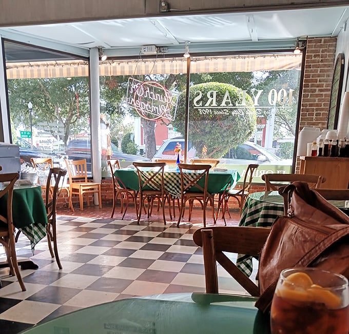 12. Sunlight streams through windows onto checkered floors, illuminating conversations that have been marinating since breakfast began.