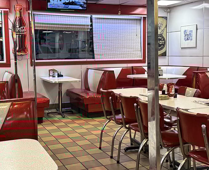 The Spot doesn't need fancy interior designers—these booths have been perfecting their welcome since before most designers were born.