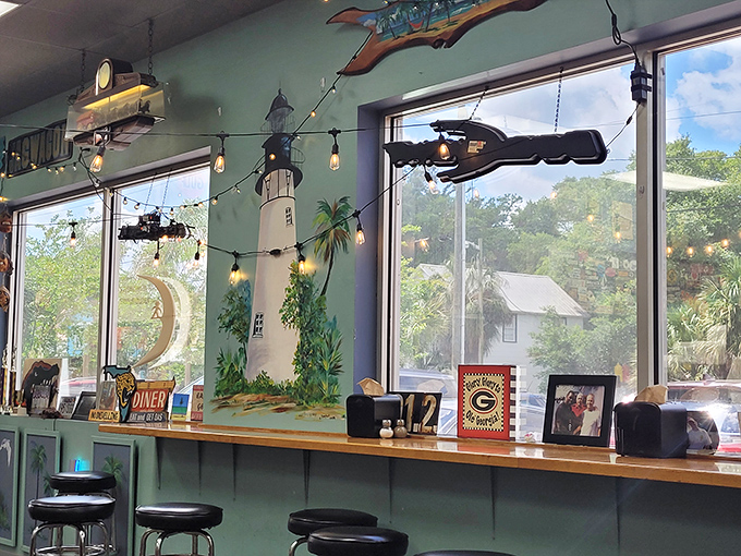 Coastal Florida meets classic Americana on these mint-green walls. The lighthouse mural reminds you exactly where these flavors call home.