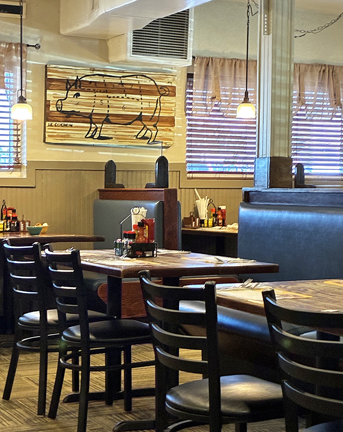 Wooden pig art watches over diners like a porcine guardian angel. At Fred's, even the décor reminds you of the importance of good barbecue.