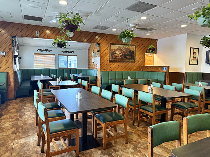 Wood paneling and mint-green chairs create the perfect backdrop for life's little moments. Hanging plants add a touch of homey charm.