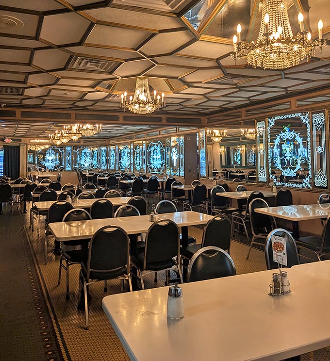 Geometric ceiling designs and elegant chandeliers create a dining room that's part palace, part community gathering space – pure Miami magic.