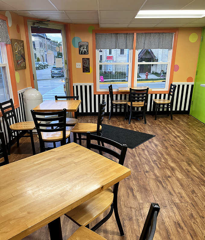 Wooden tables, cheerful polka dots, and windows overlooking Main Street create the perfect stage for ice cream drama to unfold.