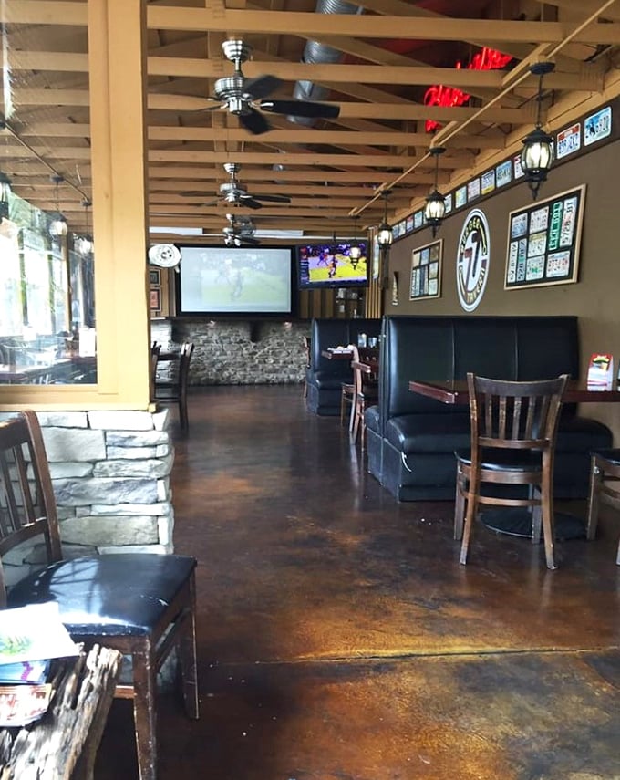 Exposed ductwork, wooden beams, and strategically placed TVs—the modern tavern trifecta that says "stay awhile" without saying a word.
