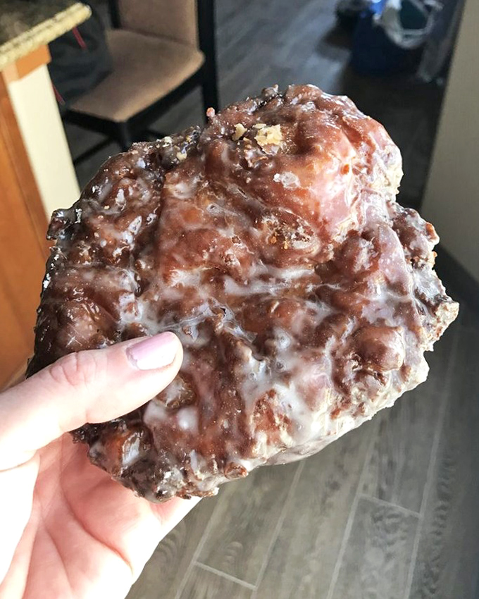 The apple fritter—a magnificent landscape of glazed peaks and cinnamon valleys that makes you wonder if it's a donut or an edible work of abstract art.