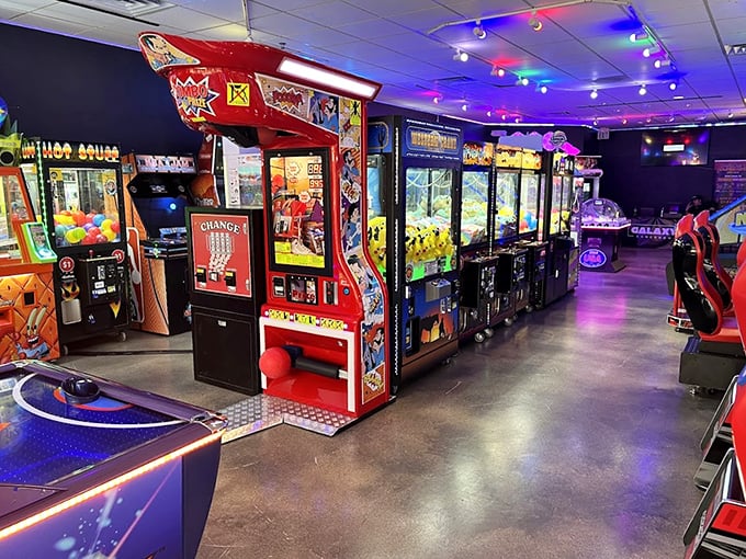 The arcade's neon glow beckons shoppers of all ages. Where parents can bribe teenagers with game tokens in exchange for one more hour of shopping.