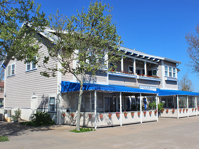 Blue awnings and white picket fences—this restaurant doesn't just serve food; it serves up the California waterfront fantasy we all secretly crave.