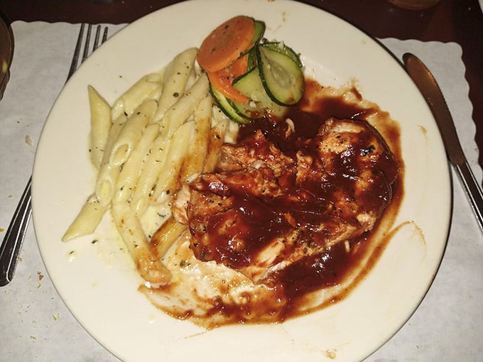 BBQ chicken that doesn't just wear its sauce—it embraces it like an old friend, alongside pasta that's clearly dressed for the occasion.