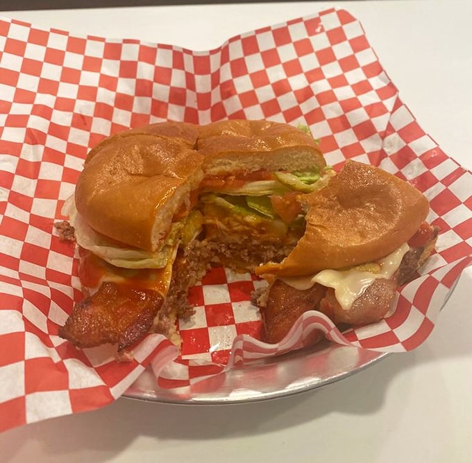A bacon cheeseburger that doesn't need fancy toppings to tell its delicious story—just quality ingredients and perfect execution.