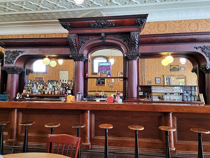 The bar at Kissner's isn't just serving drinks—it's serving history with its ornate woodwork and century-old craftsmanship that simply doesn't exist anymore.