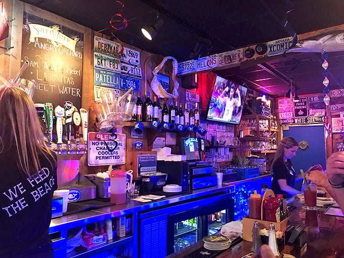 The bar glows with an underwater blue that makes every drink feel like it's being served in Atlantis's favorite neighborhood pub.