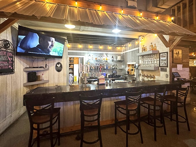 The bar area combines country charm with modern convenience—the perfect spot to sample a local brew while waiting for your table.