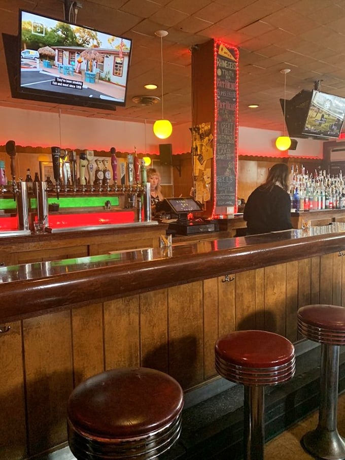 The bar at Happy Dog isn't just serving drinks; it's serving community, conversation, and the liquid courage to try that Froot Loops topping.