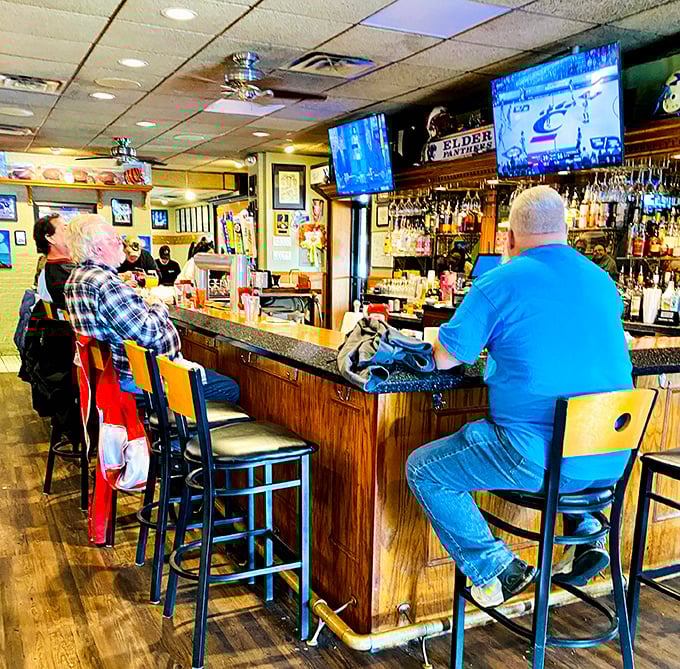 The Golden Fleece Lounge: where Cincinnati sports are religion, regulars are royalty, and your drink arrives before you've fully settled onto your barstool.