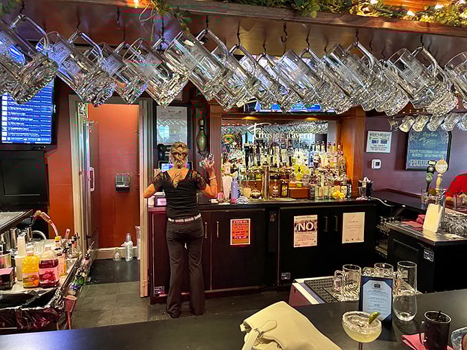Hanging glasses catch the light like crystal chandeliers while the well-stocked bar promises libations for every palate. Liquid happiness awaits.