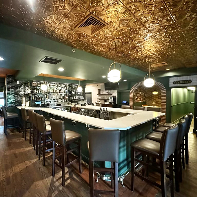 The bar's ornate ceiling gleams like buried treasure, watching over patrons as they debate between martinis and manhattans.