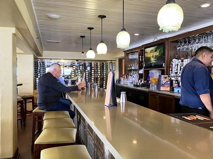The bar where locals and tourists find common ground over coastal cocktails while debating which is more intoxicating – the drinks or the view.