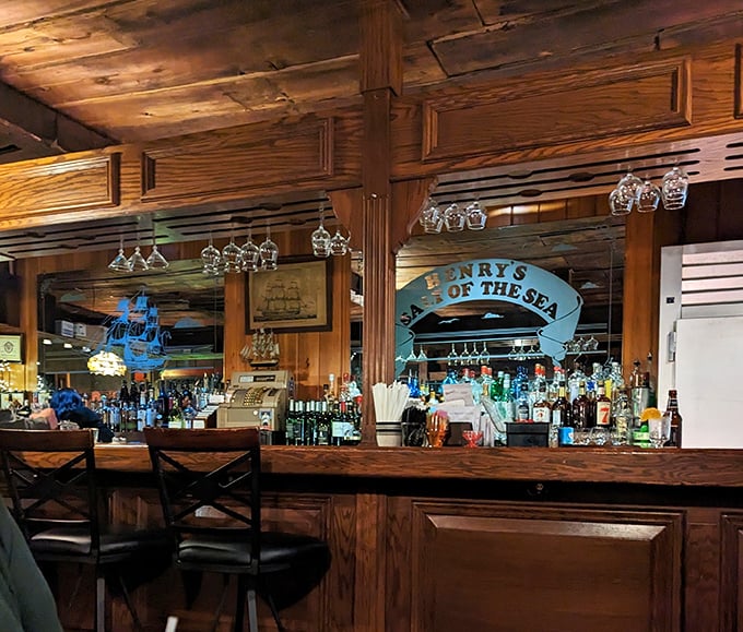 The bar area doesn't just serve drinks—it serves stories. Wood, brass, and nautical touches create the perfect backdrop for seafood tales.