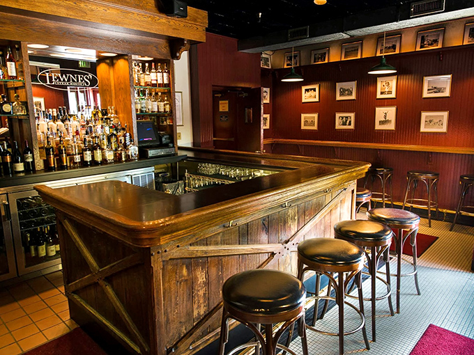 The bar area whispers of nightcaps, deal-making, and the kind of conversations that only flow when surrounded by dark wood and amber liquids.