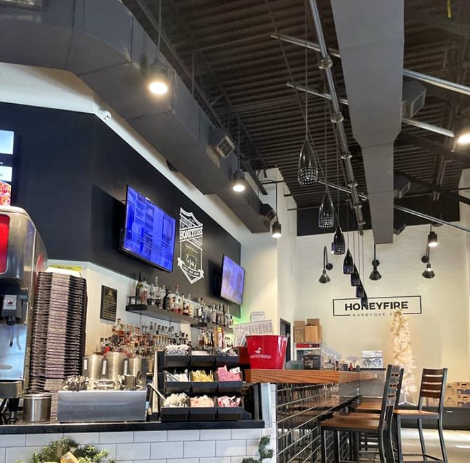 The bar area – where bourbon meets barbecue in a match that feels predestined, like peanut butter meeting jelly for the first time.