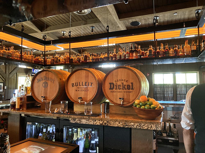 The whiskey barrels aren't just for show—they're a promise. This bar takes its bourbon as seriously as a Kentucky colonel takes his secret recipe.