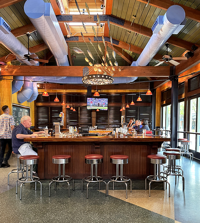The bar isn't just a place to wait for your table—it's command central for cocktail magic and spontaneous friendship formation.