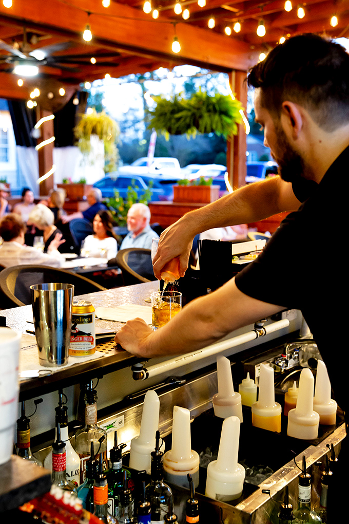 Mixology meets artistry as the bartender crafts a drink with the precision of a surgeon and the flair of a Broadway performer.