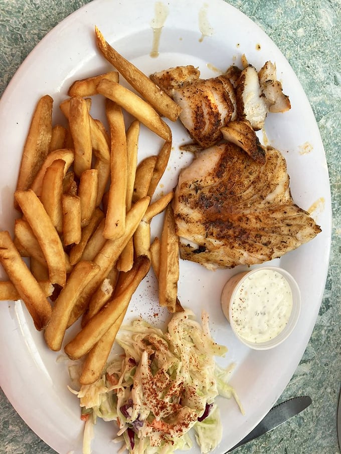 Blackened grouper that doesn't need fancy plating—just perfectly seasoned fish, honest sides, and a reminder that simple food done right is culinary magic.