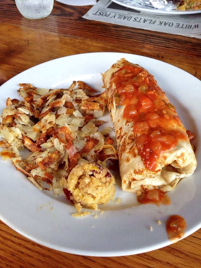 A breakfast burrito that's been working out—muscular with fillings and flexing with flavor. That salsa adds the perfect morning kick.