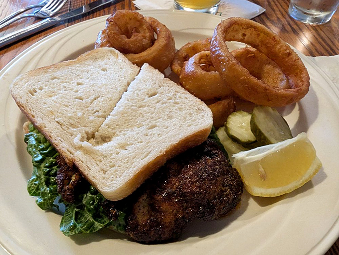 This sandwich plate has everything: crispy calamari, tangy pickles, and the quiet confidence of a dish that knows exactly what it's doing.
