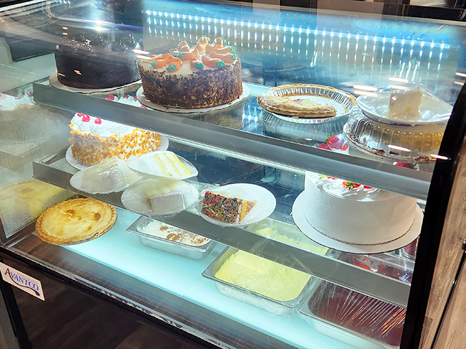 The dessert case—where willpower goes to die and "I'll just have coffee" turns into "and a slice of that chocolate cake, please."