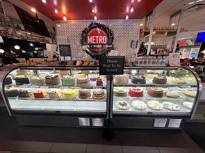 The dessert case that's launched a thousand diet cheat days. Each cake stands tall like a sugary skyscraper of possibility.