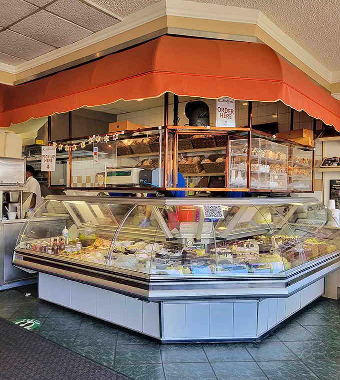 A deli case that belongs in the Louvre—a masterpiece of meats, salads, and spreads that makes decision-making delightfully impossible.