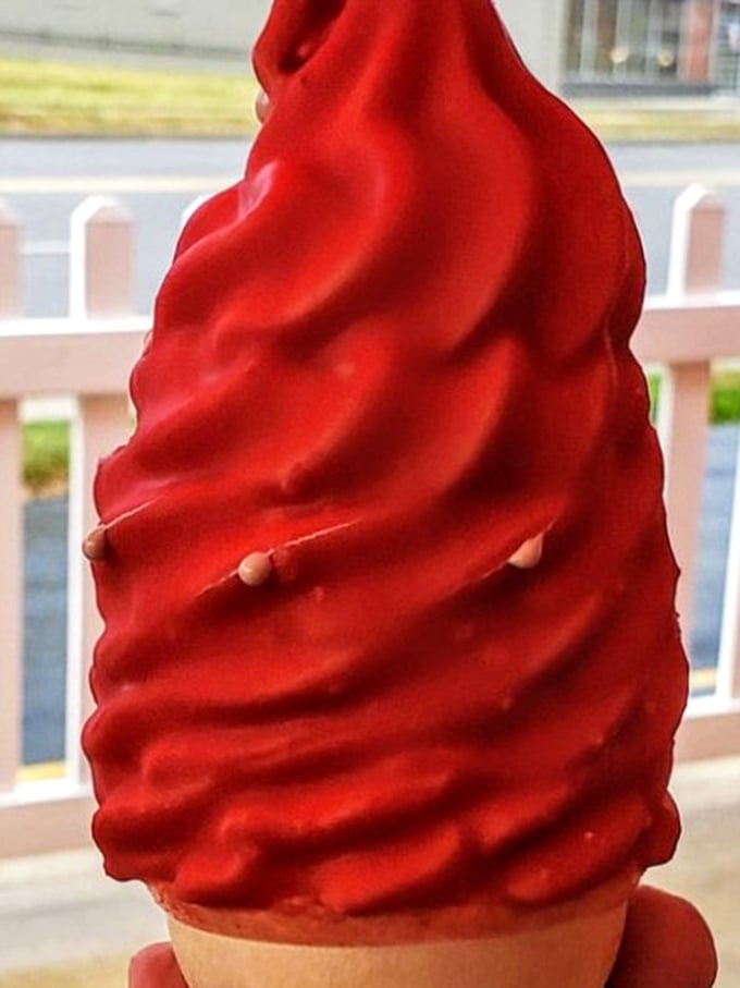 That cherry-red swirl isn't just a color—it's a childhood memory you can taste. Dipped cones: the dessert that improves with absolutely zero innovation.