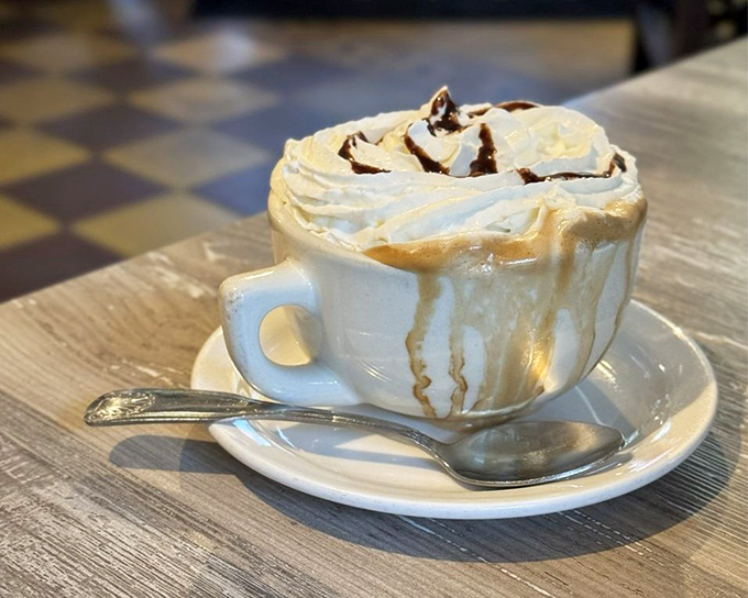 This isn't just coffee—it's a cloud of whipped cream floating atop liquid motivation, with chocolate drizzle playing the role of artistic muse.