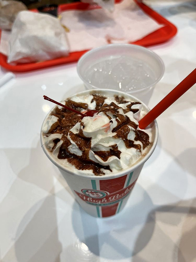 A chocolate shake so thick it defies gravity. The cherry on top isn't just decoration—it's the exclamation point on a sweet statement.