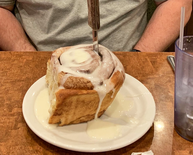 This cinnamon roll isn't just breakfast—it's an event, a celebration, a reason to skip your morning meeting. Worth every sticky finger.